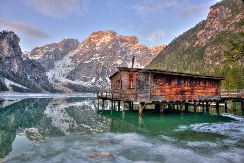 Shack On Body Of Water Surrounded By Mountains Picture. Image: 116695322