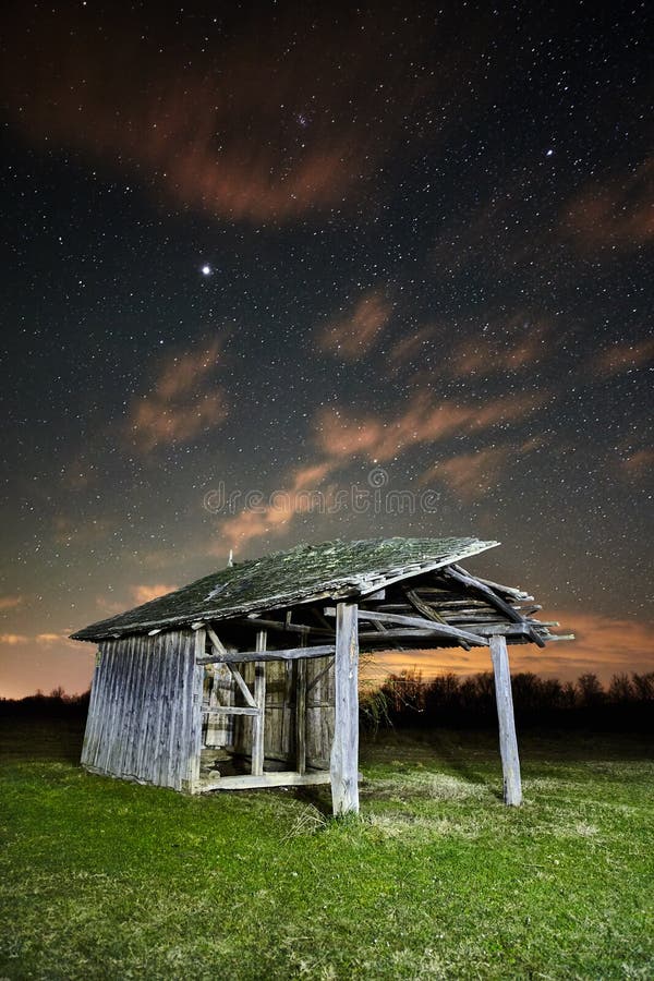 Shack on a meadow at night stock image. Image of hole - 48473151