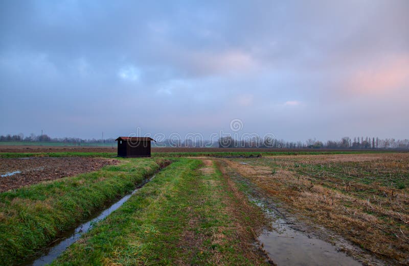 A Shack in a Ploughed Field at Sunset in Autumn Stock Image - Image of ...