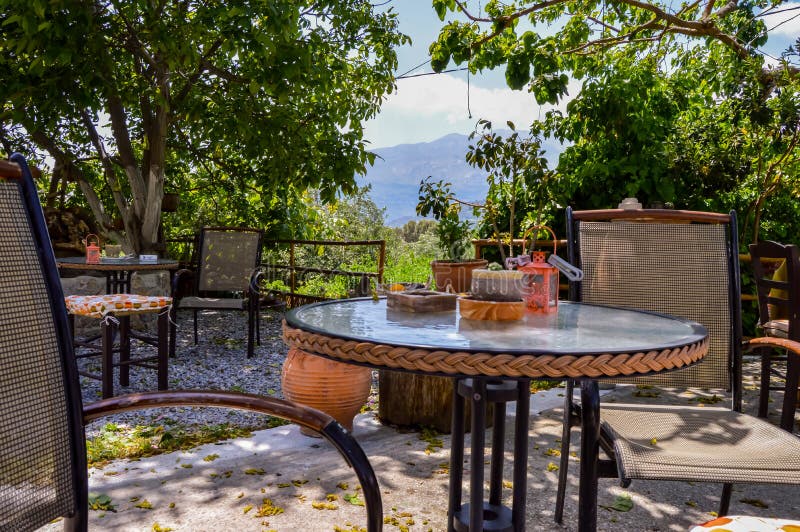 Shaded Terrace with Round Tables Stock Image - Image of landscaping ...