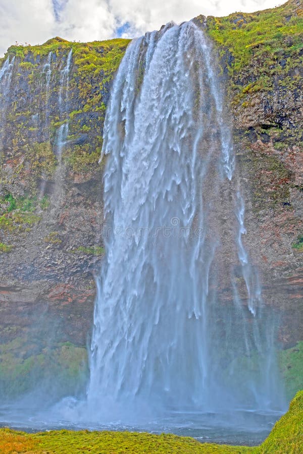 Shaded Waterfall Roaring Over a Cliff Stock Photo - Image of shaded ...