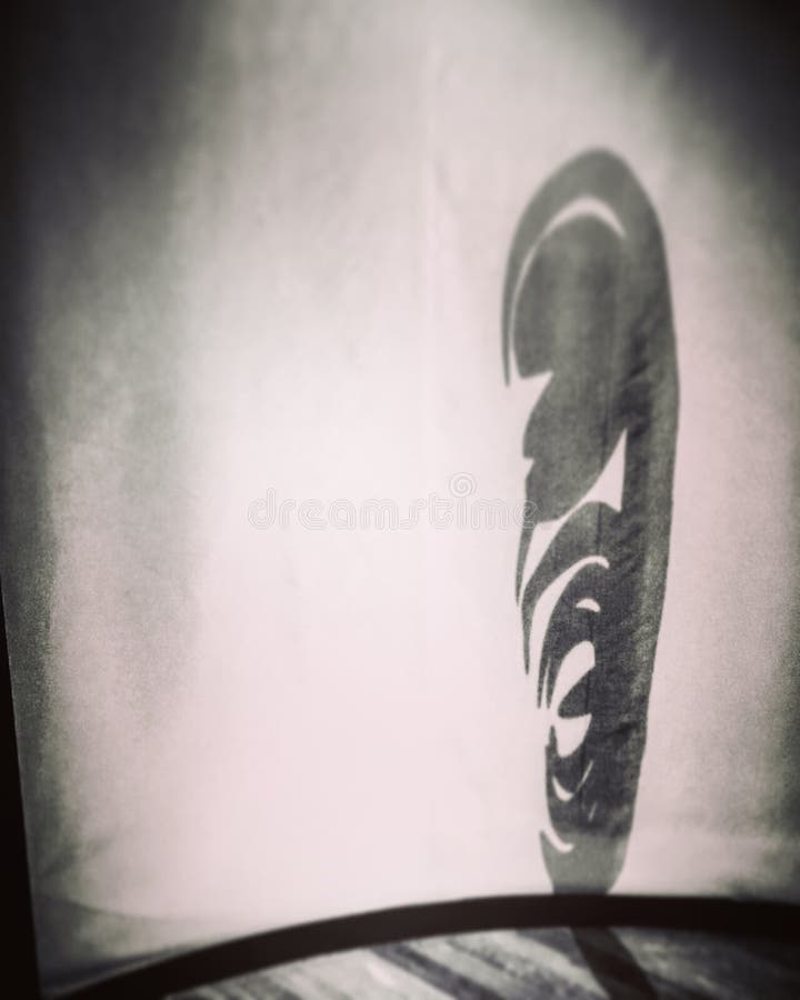 Shadow of African statue stock image. Image of african - 80720383