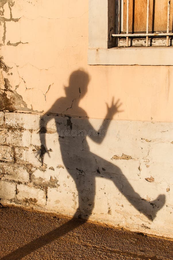 Shadow against a wall stock image. Image of walking, human - 34749309