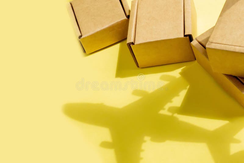 Shadow Airplane and Stack of Cardboard Boxes. Concept of Air Cargo and ...