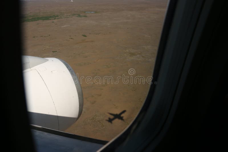 A Shadow of an Airplane Which is Landing at an Airport Stock Image ...