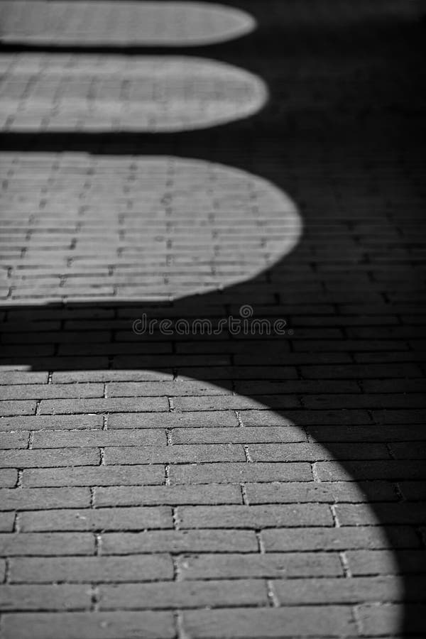 Shadow of an Archway on Cobblestone Stock Photo - Image of cobblestones ...