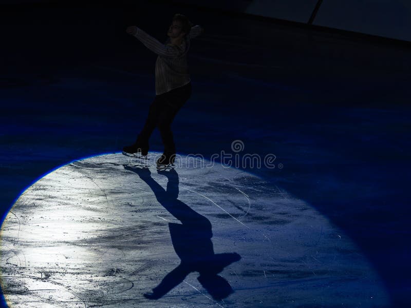 Shadow of an Athlete Skater Reflected on the Ice Rink during the ...
