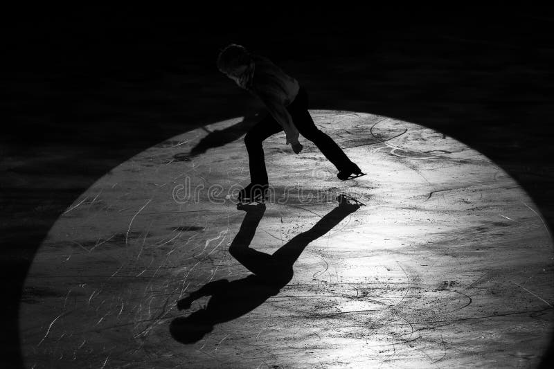 Shadow of an Athlete Skater Reflected on the Ice Rink during the ...