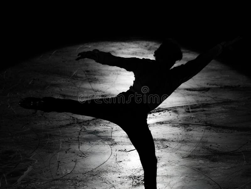 Shadow of an Athlete Skater Reflected on the Ice Rink during the ...