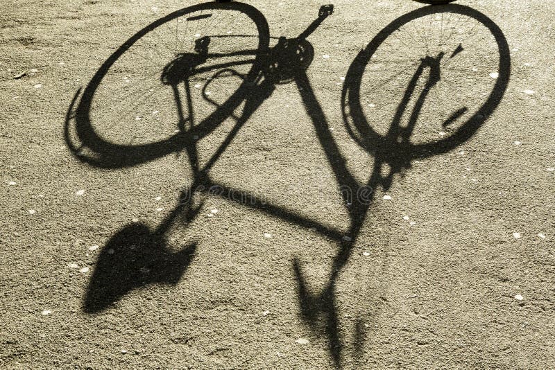 Shadow of the bicycle stock image. Image of asphalt - 106847903