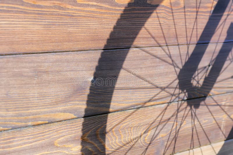 Shadow from Bicycle Wheel on the Wooden Boards Stock Image - Image of ...