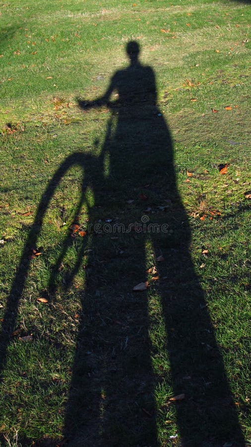 Shadow Of The Bike And Biker Stock Photo - Image of reflection, biker ...