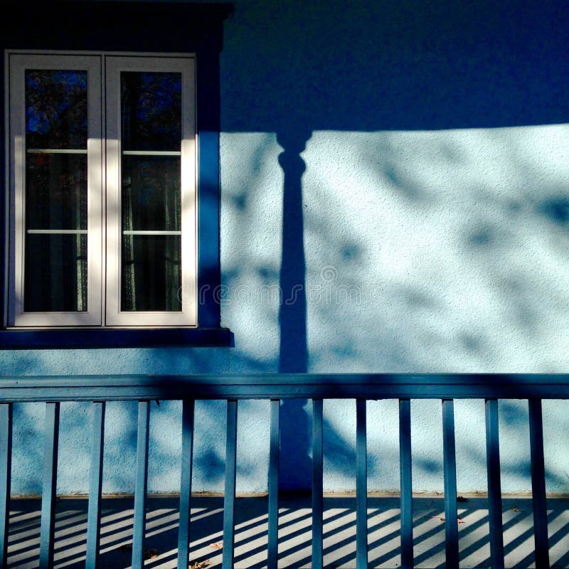Shadow of a blue balcony stock photo. Image of outdoors - 62599720