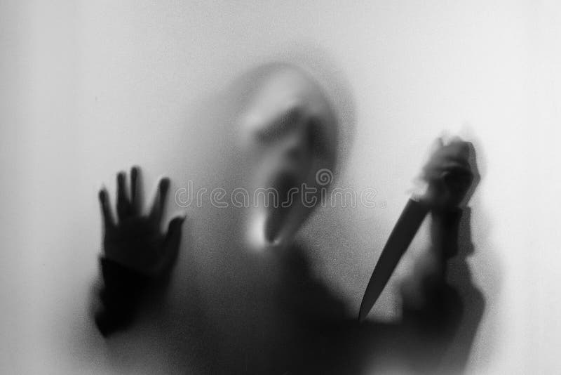 Shadow Blur Of Horror Man In Screaming Mask And Show Knife In Hi Stock