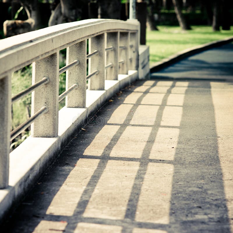 Shadow on the bridge stock image. Image of park, railing - 17696365
