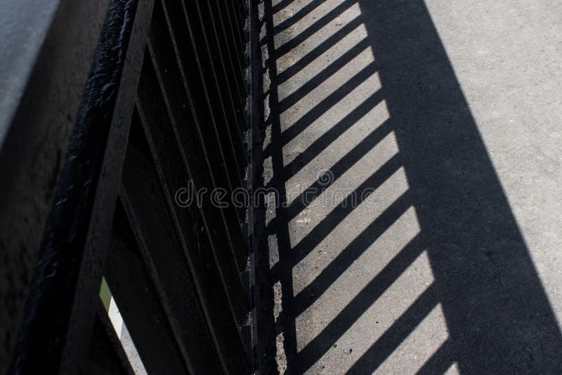 The Shadow of the Bridge Railing Stock Photo - Image of shadow, pattern ...