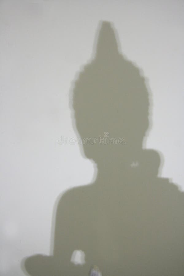 Shadow of a Buddha Statue on a White Wall. Stock Photo - Image of ...