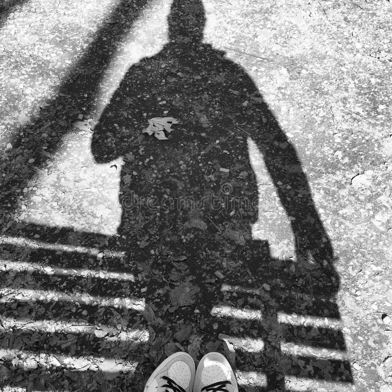 Shadow cast by sitting man stock photo. Image of contrasting - 52495536