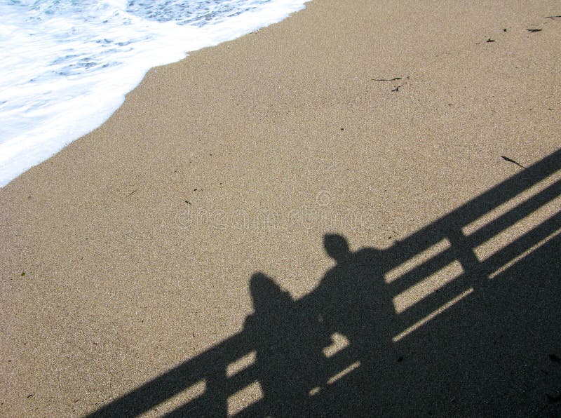 Shadow of couple on beach stock photo. Image of lifestyle - 25477918