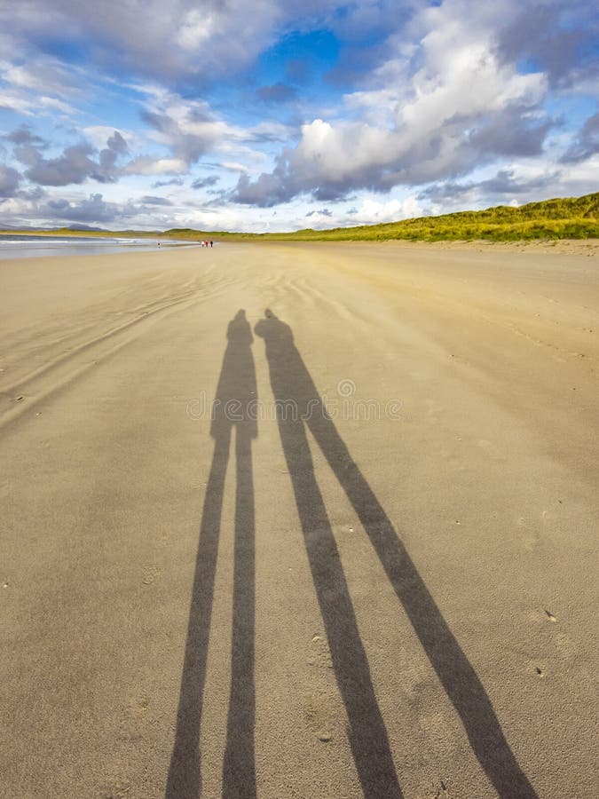 Shadow of Couple Enjoying the Beach Stock Image - Image of shadow ...