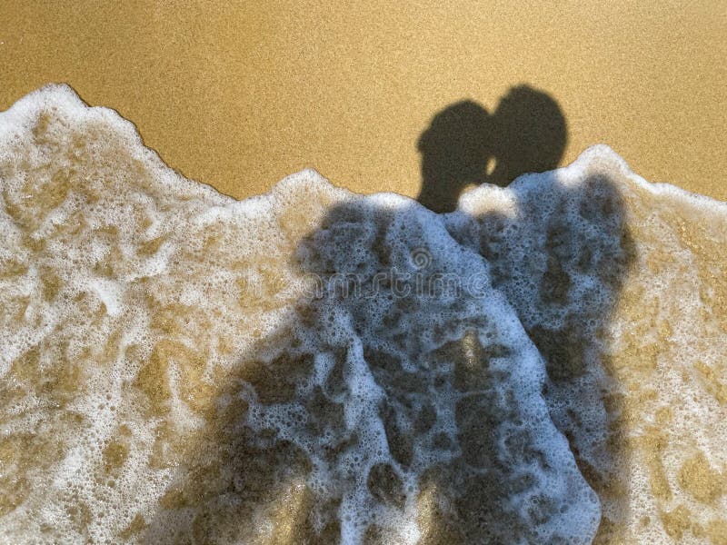 Shadow of a Couple on the Sand Stock Image - Image of coast, sand ...