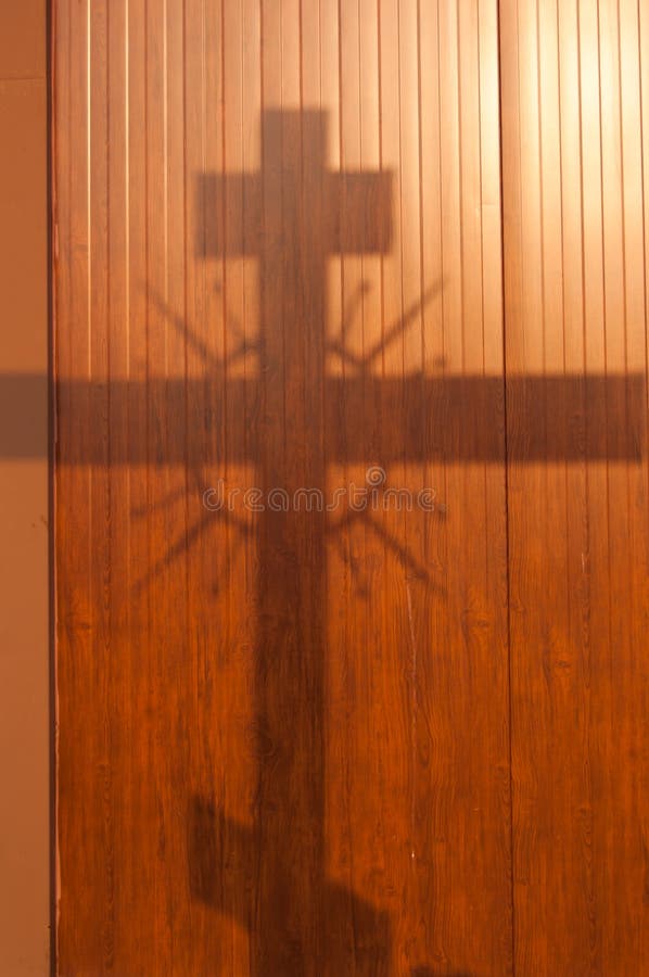 Shadow of the Cross from the Setting Sun on Wall of Wooden Panels Stock ...