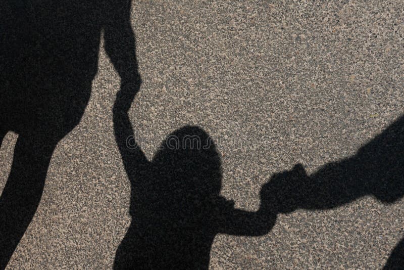 Shadow of a Family with a Child Holding Hands Stock Image - Image of ...