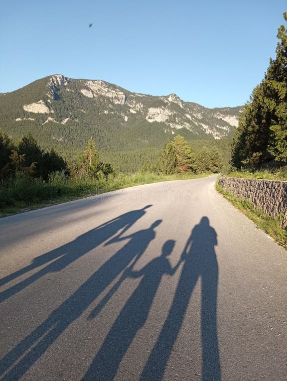 Shadow of Family Standing on Road Stock Image - Image of asphalt ...