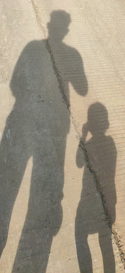 A Shadow of a Father and Son Walking Together Stock Photo - Image of ...