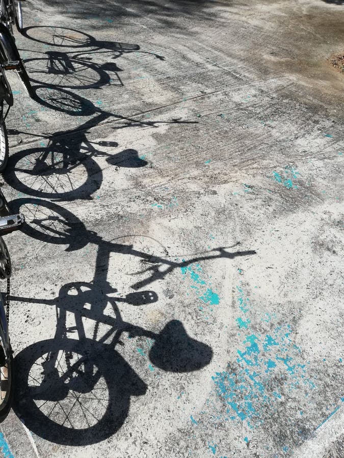 Shadow of bike stock photo. Image of street, bike, shadows - 120232726