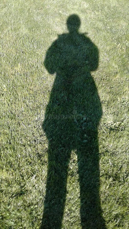 The Shadow of a Giant on the Grass Stock Image - Image of field, summer ...