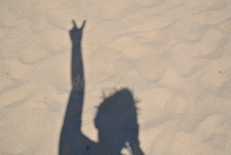 Shadow of a Girl in the Sand Stock Photo - Image of sketch, raising ...