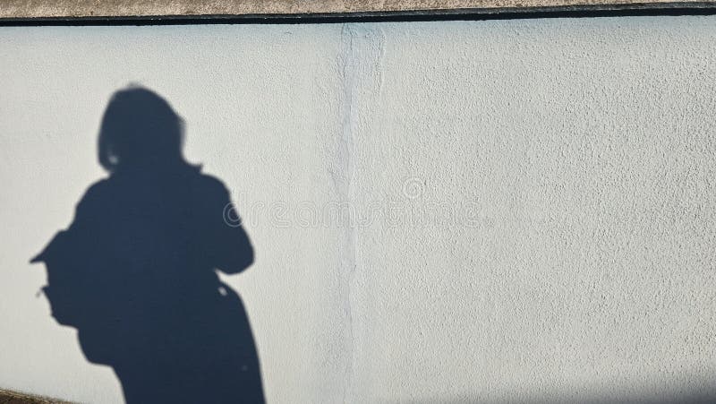 The Shadow of a Girl on the Wall Stock Image - Image of girl, street ...