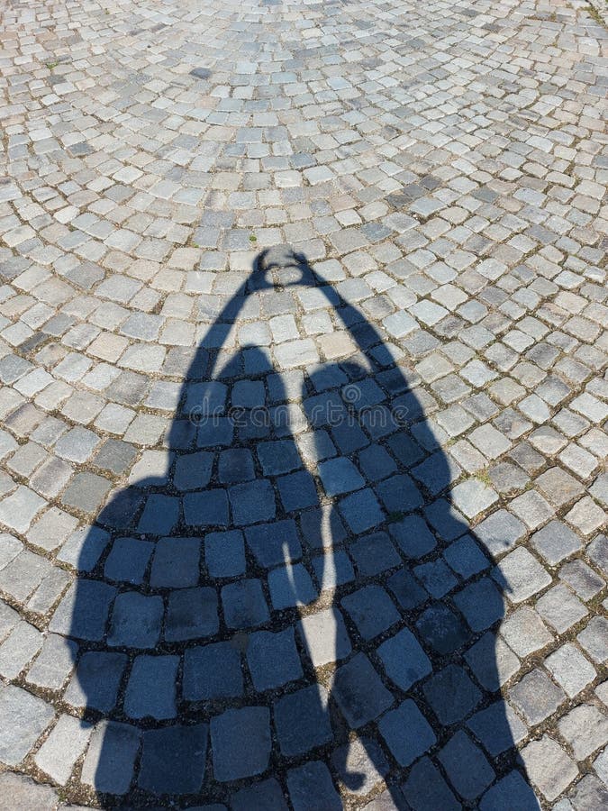 Shadow of Two Girls Holding Hands Walking by the Beach Stock Image ...