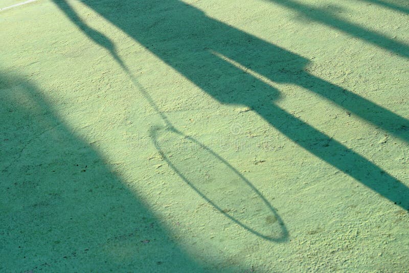 Shadow on the Ground with Badminton Racket Stock Photo - Image of ...