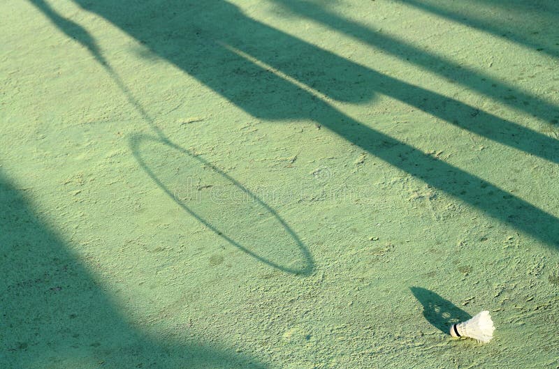 Shadow on the Ground with Badminton Racket and Old Shuttlecock Stock ...