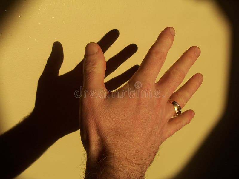 Shadow of a hand stock image. Image of parts, wall, fingers - 1650557