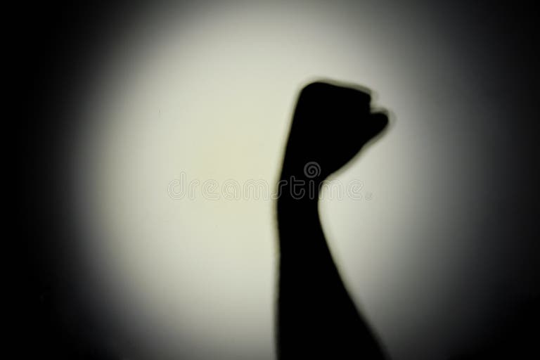 Shadow of a Hand from the Night Light of a Flashlight on a White Wall ...