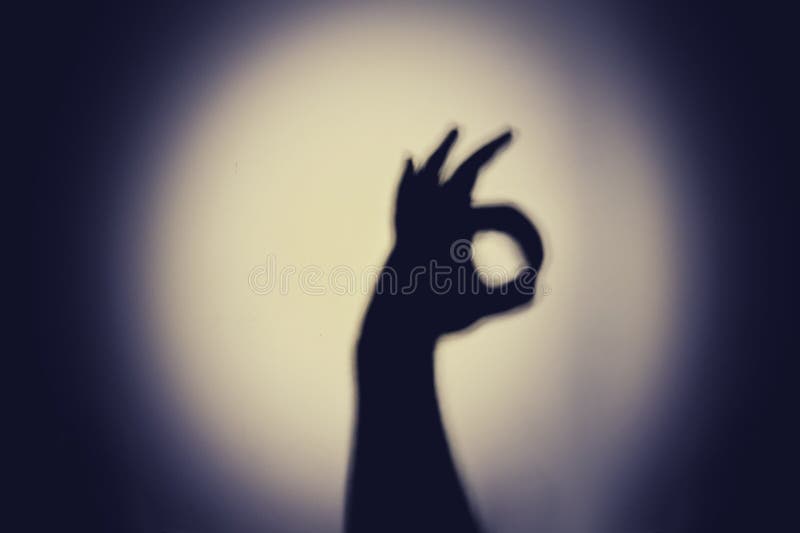 Shadow of a Hand from the Night Light of a Flashlight on a White Wall ...