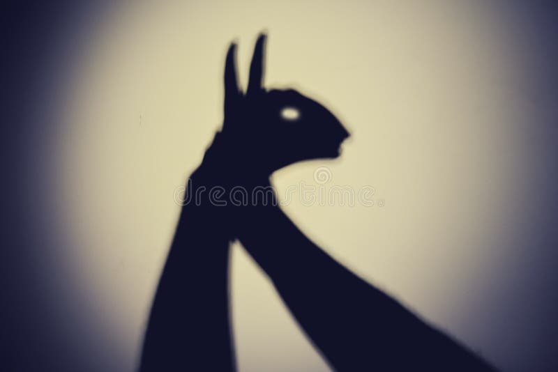 Shadow of a Hand from the Night Light of a Flashlight on a White Wall ...