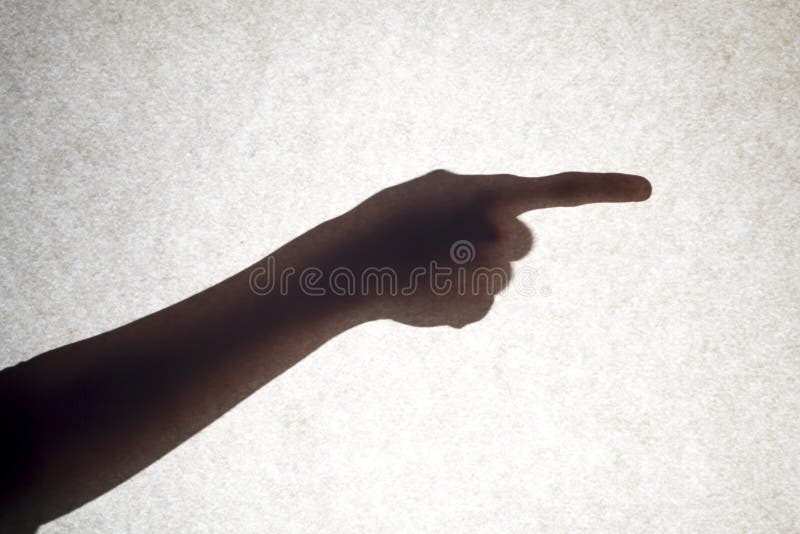 The Shadow of a Hand with an Outstretched Finger Points To the Side ...