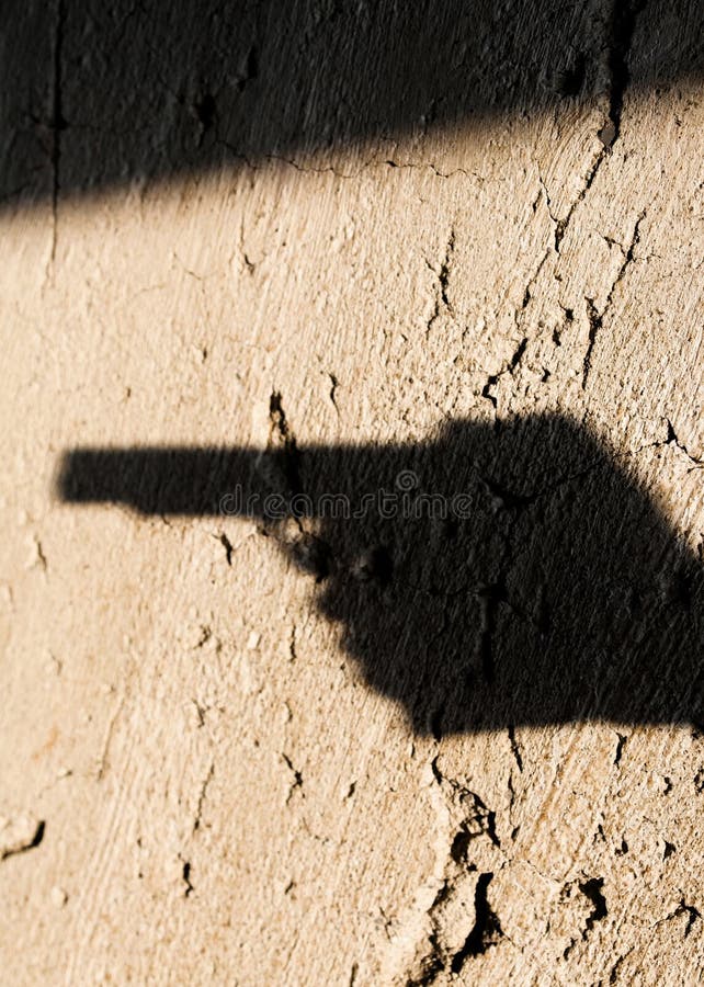 Shadow of the hand pointing a gun, Shadow of the hand pointing a gun ...