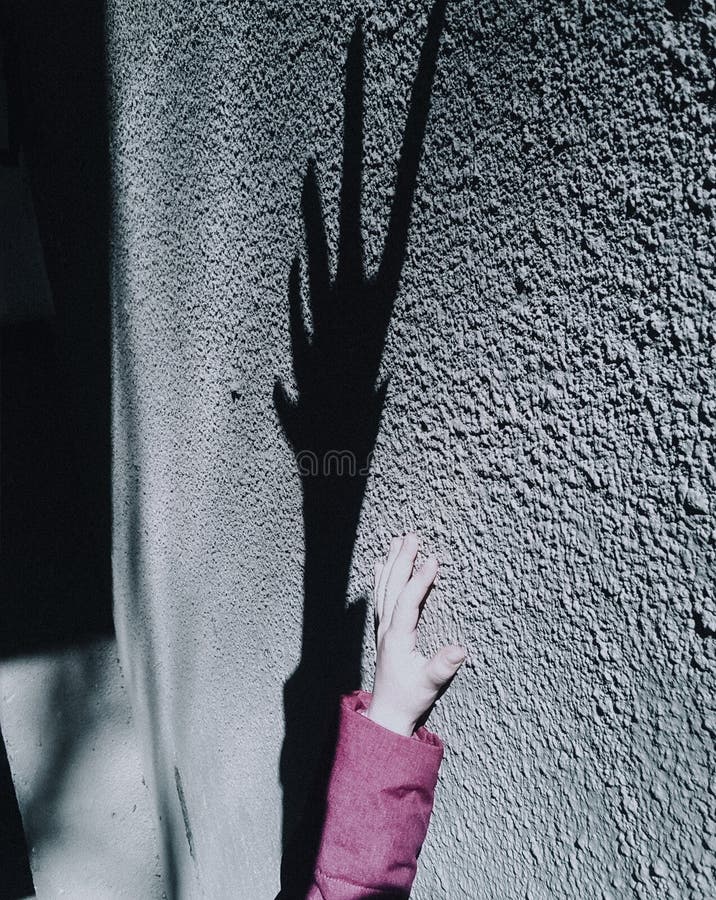 Shadow hands in comparison stock photo. Image of shadows - 114684736