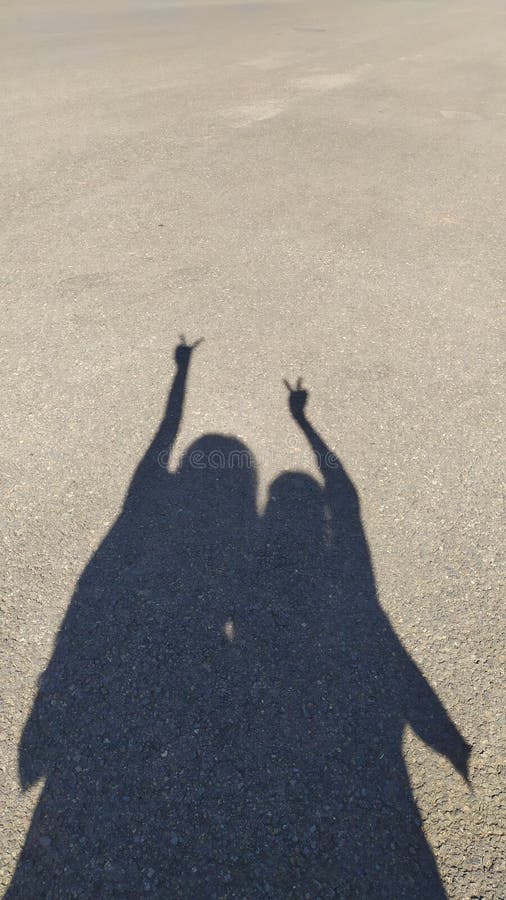 The Shadow of a Happy Two Young Girls Stock Image - Image of young ...