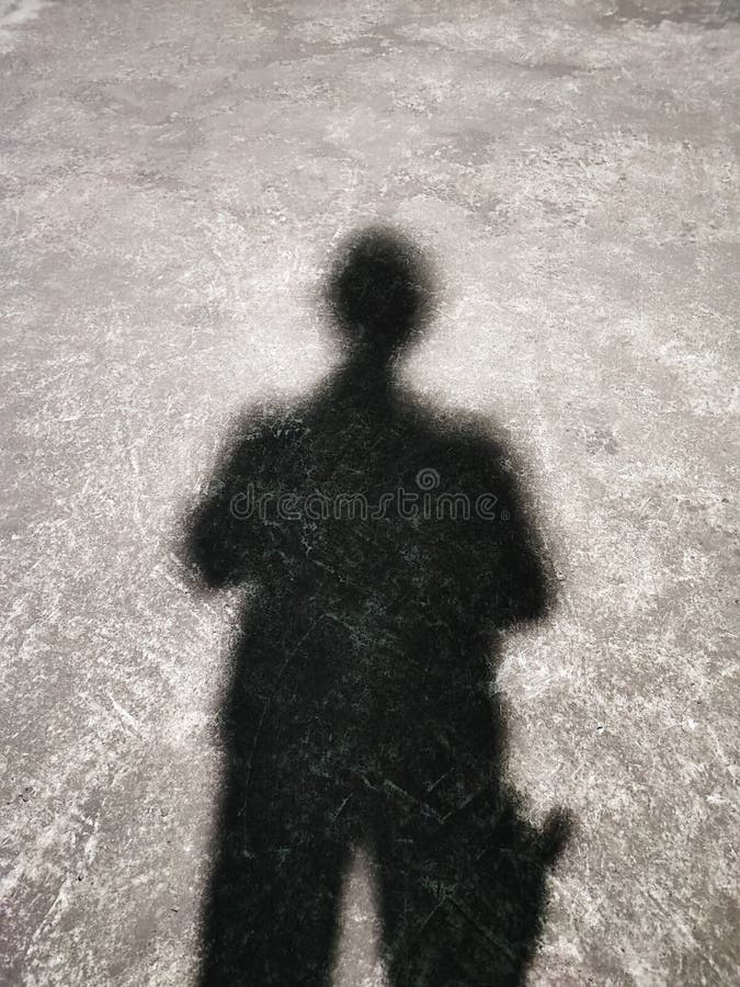 The Shadow of a Human Figure Standing Upright Stock Photo - Image of ...