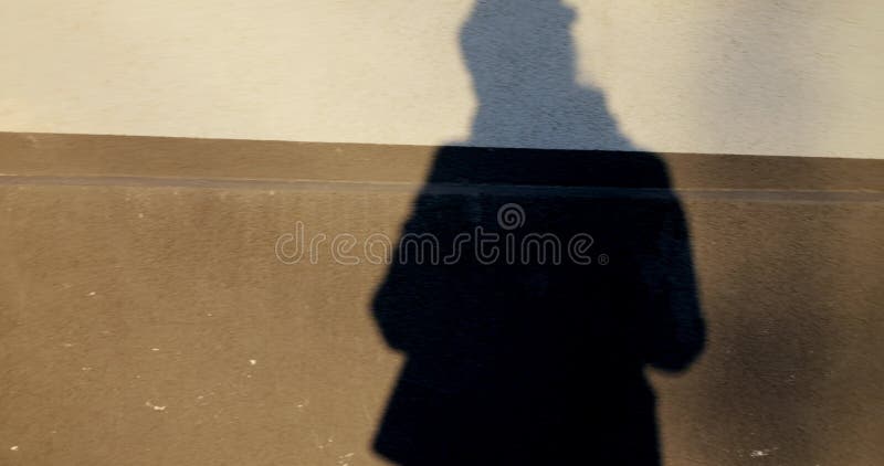 Shadow of Human Gradually Changing on Two Tone Wall, Projecting Subtle ...