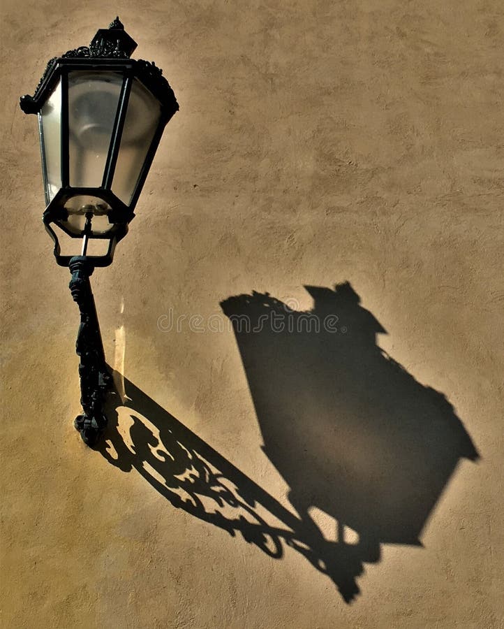 The Shadow Of Lamp Post That Have A Sign Of Two Golden Deer And Dharma ...