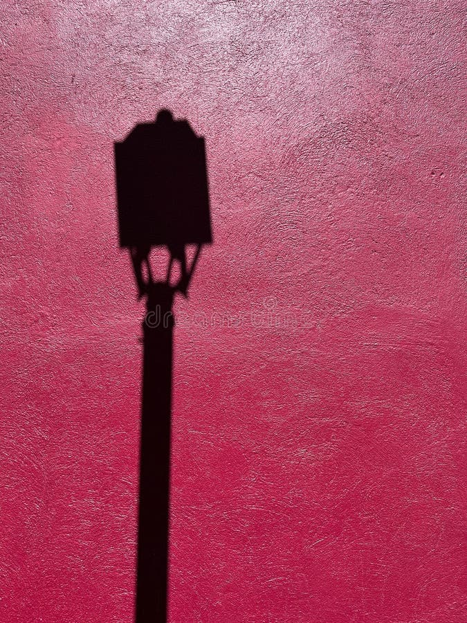 The Shadow of a Lamp Post on a Red Wall Stock Photo - Image of black ...