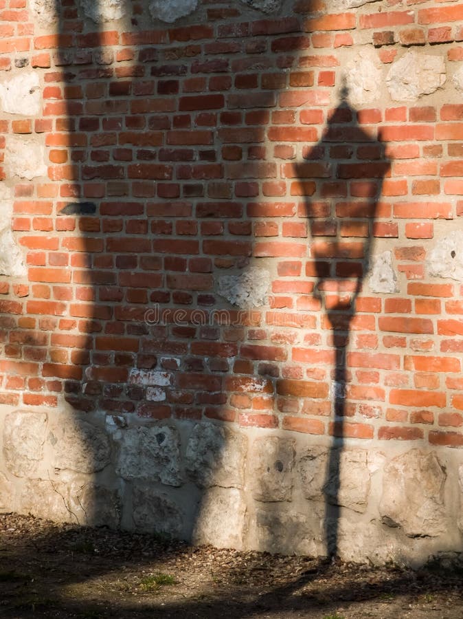 Shadow from Lantern and Tree on Brick Wall on Sunny Day. Stock Photo ...
