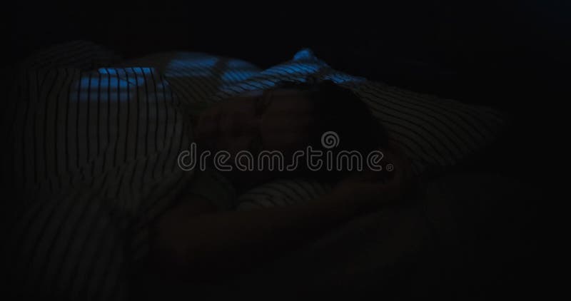 A Shadow from a Lightning Flash on a Sleeping Woman Stock Footage ...